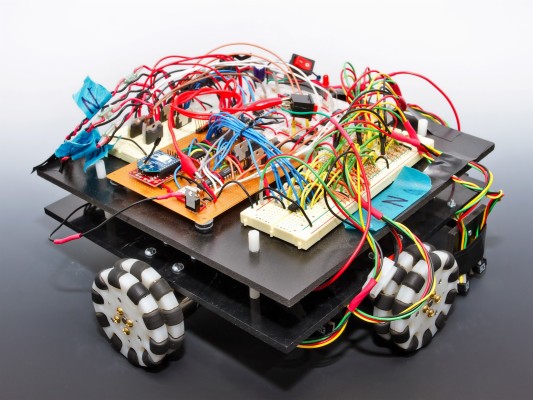A Square Robot With Exposed Circuitry And Black And - Computer ...